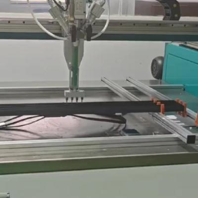 China Glue Dispensing Machine designed for automatic silicone dispensing on backlit panel boards used in LED light assembly lines for sale