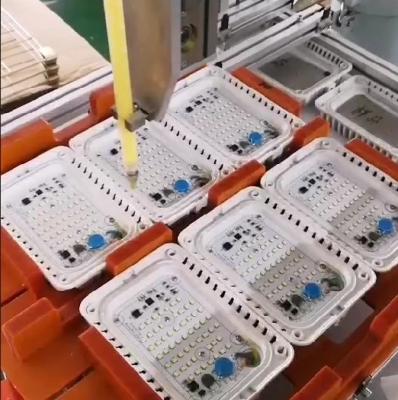 China Automatic Glue Dispensing Machine with three axis programmable movement and designed fixture for accurate glue coating on work pieces for sale