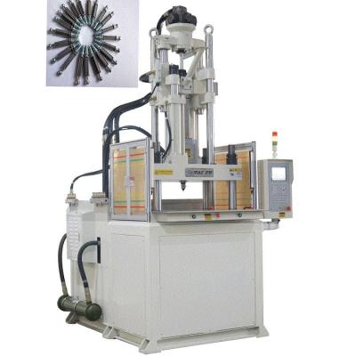 China Máquina de moldeo por inyección de plástico vertical de 120 toneladas de alto rendimiento utilizada para tornillos en venta