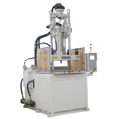 Cina Macchina di stampaggio a iniezione verticale standard da 120 tonnellate per la fabbricazione di ruote per bagagli in vendita
