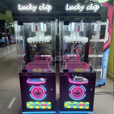 China Brazil Popular Arcade Clip Mini Game Machine Lucky Clip Prize Machine 24 Clips Coin Operated Machine for sale