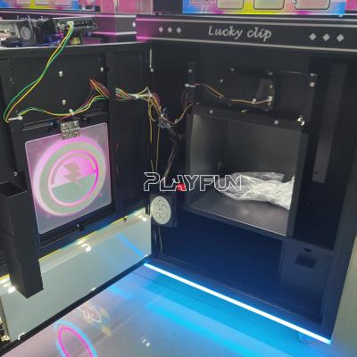 China Brazil Popular Arcade Clip Mini Game Machine Lucky Clip Prize Machine 24 Clips Coin Operated Machine for sale