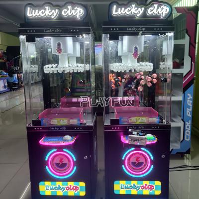 China Brazil Popular Arcade Clip Mini Game Machine Lucky Clip Prize Machine 24 Clips Coin Operated Machine for sale
