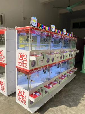 Cina Logo personalizzato Mini giochi di gru di artiglieria boutique premio gioco mini bambino buon spettacolo 4 giocatori mini macchina di artiglieria bambino in vendita in vendita