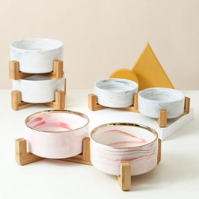 Cina Ciotole alzate ceramiche di marmo amichevoli del cane di Eco con il supporto di legno in vendita