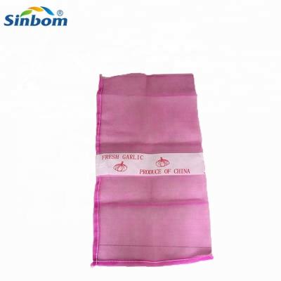 Cina Confezionamento di aglio fresco Pp Frutta Sacchetto a corda a maglia rosa Realizzato in materiale 100% PP/PE in vendita