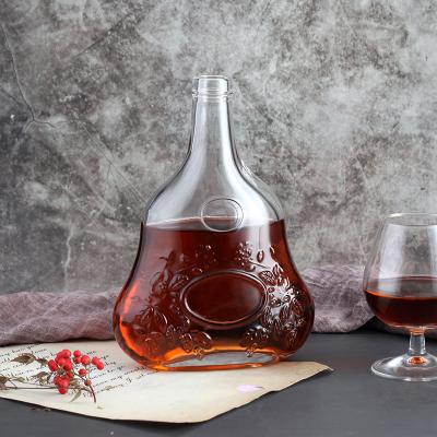 China Garrafa de vidro de licor de vinho e uísque com tampa de cortiça transparente redonda vazia e tamanho personalizado à venda