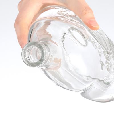 China Garrafa de vidro de licor de vinho e uísque com tampa de cortiça transparente redonda vazia e tamanho personalizado à venda