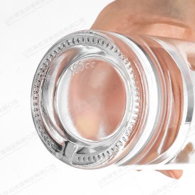 Cina Bottiglia di vetro trasparente personalizzata Mini 100ml 300ml 400ml per bevande alcoliche in vendita