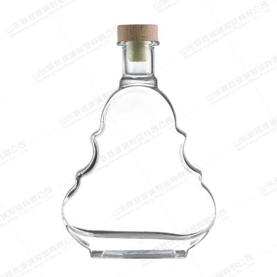 China 1L garrafa de vidro criativa para bebidas alcoólicas tampa de vidro etiqueta personalizada transparente à venda
