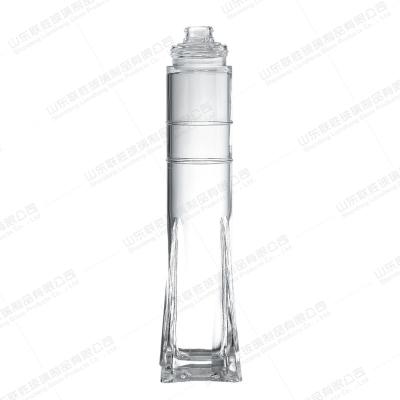 China Garrafa de vidro de 700 ml com tipo de vedação de tampa de vidro e superfície decal para gin e tequila à venda