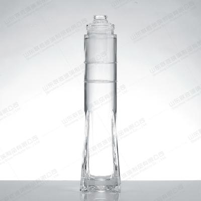 Cina 700 ml bottiglia di vetro con tipo di chiusura del coperchio di vetro e superficie deccale per gin e tequila in vendita
