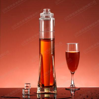 Cina 700 ml bottiglia di vetro con tipo di chiusura del coperchio di vetro e superficie deccale per gin e tequila in vendita