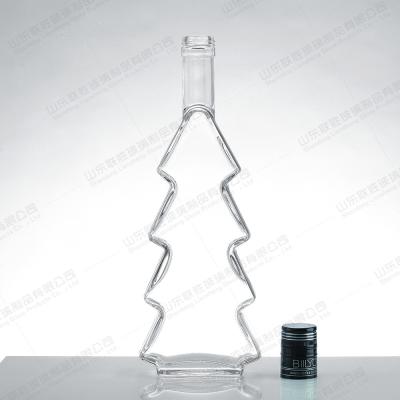Cina Altre bevande 500 ml bottiglie di vetro per albero di Natale con tappo a vite Decorazione chiara e vuota in vendita