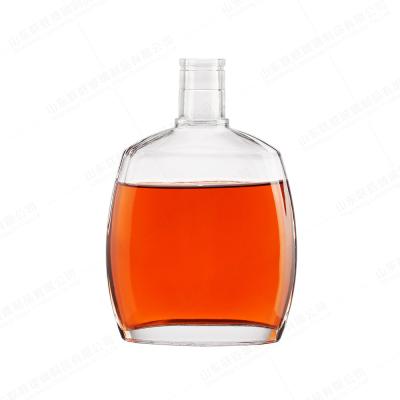 China Garrafa de tequila de vidro transparente com tampas de ouro Grande tamanho e material de base Vidro à venda