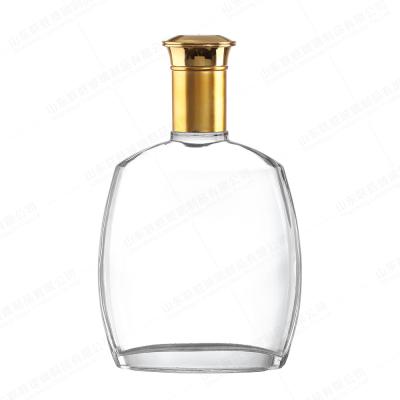 Cina Bottiglia di tequila in vetro trasparente con coperchio dorato in vendita