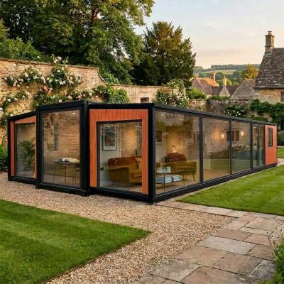 China Brick Color Wall Panel And Black Frame Expandable Container House With Kitchen And Wooden Floor for sale