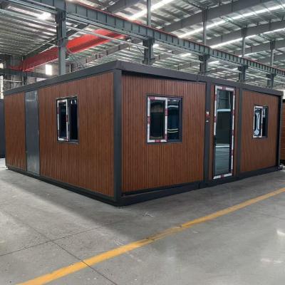 China Rustic Timber Grain Luxury Expandable Villa with Deep Charcoal Framework and Panoramic Resort Homestay Suite for sale