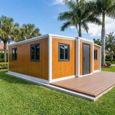 China 20ft Expandable Container House with Wood-Grain Cladding and Dark Grey Window Frames for sale