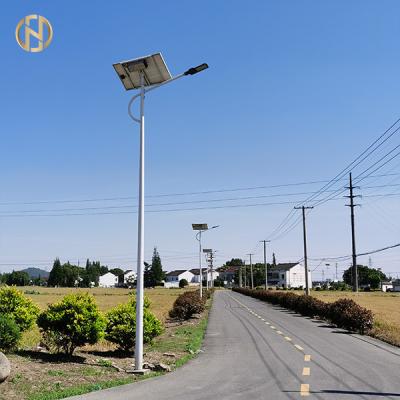 China 3-12M Octagonal Shape Road Lamp Post Q345B Double Arm High Durability for sale