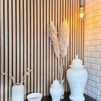 China MDF Wood Slat Acoustic Panel 27mm Strip Width 13mm Gap Sound Absorbing Wall Ceiling Panel for sale