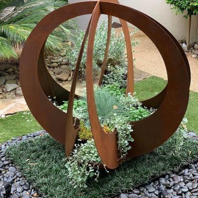 Cina Grandi piantatrici decorative del fiore della palla della lama del metallo di Corten per il paesaggio del giardino in vendita