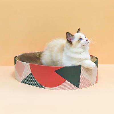 Cina Bordo ondulato ovale Cat Scratching Board interattiva di Cat Scratching Cardboard Durable Recycle in vendita