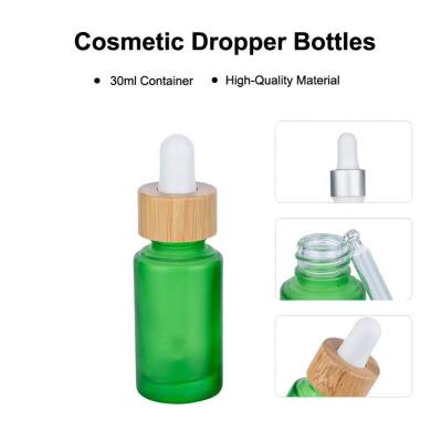 China 30ml Frosted Green Glass Dropper Bottles Essential Oil Bottle With Bamboo Dropper for sale
