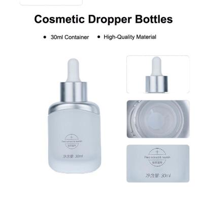 China 30ml Silver Glass Dropper Bottles Transparent Elegant Glass Eye Dropper Bottles for sale