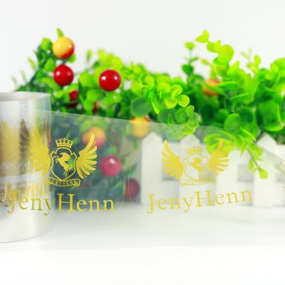China Self Adhesive Transparent Clear Labels Gold Foil Logo Stickers Label for sale