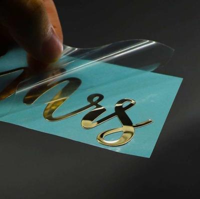 中国 防水透明な明確なラベルのステッカーの移動の金属の手紙によって浮彫りにされるニッケルのデカール 販売のため