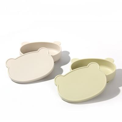 Cina piastrina supplementare dell'alimento della ciotola del bambino del silicone 50K con la ciotola resistente della caduta dei bambini del fumetto dell'orso del coperchio in vendita