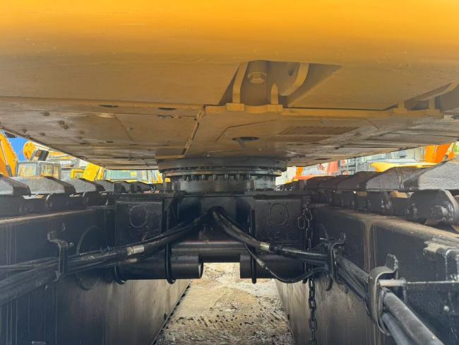 Side view of used Cat 320CL Excavator showing boom and bucket