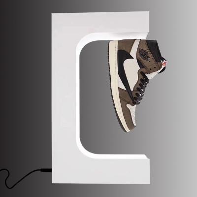 China Fashion levitating magnetic floating shoes display stand and shop display for shoes fancy sever shoes display unit white for sale