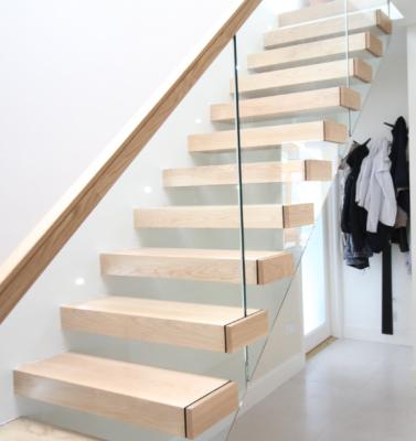 China Modern steel stringer staircase wood floating stairs glass railing prices for sale