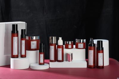 Cina Il colore rosso d'imballaggio cosmetico vuoto dell'insieme ha glassato la stampa della bottiglia del siero della crema di fronte in vendita