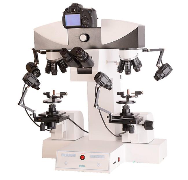 Close-up of microscope eyepieces and controls