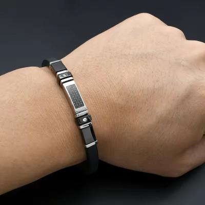 Cina Stainless Steel Soft Rubber Bracelet with Carbon Fiber Plate Punk Style White Setting CZ Silicone Luxury Men's Jewelry in vendita