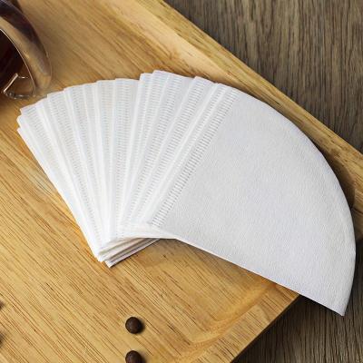 China Disposable V Shaped Coffee Filter Paper Hand Drip Coffee Filter Paper And Storage Holder for sale
