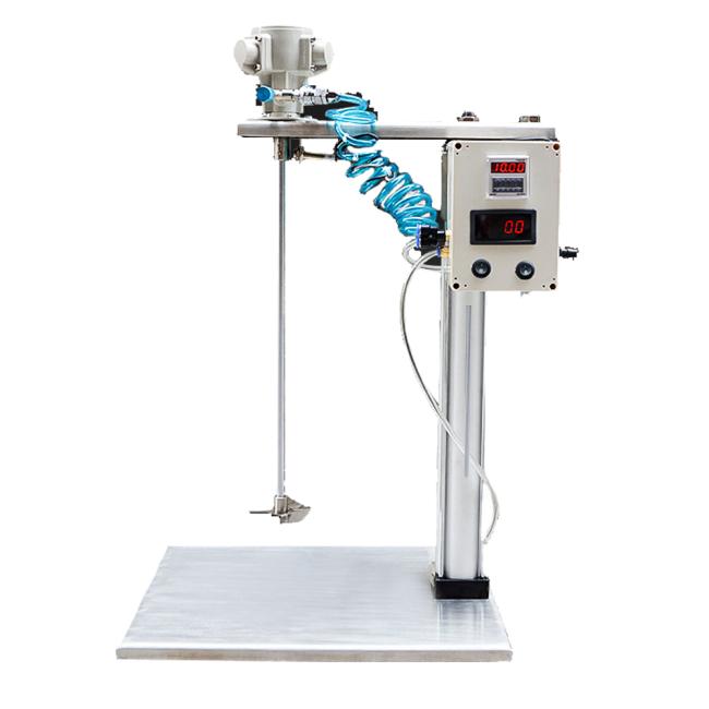 Side view of pneumatic mixer in industrial setting with equipment background
