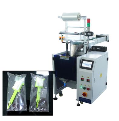 China Automatic Belt Type Kitchen And Bathroom Accessories Vertical Plastic Parts Packaging Machine for sale