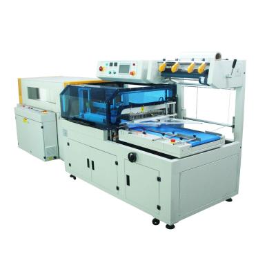 China Pe Film Automatic Box Book Pizza Film Packing Shrink Wrapping Machine For Carton Box for sale