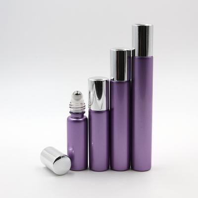 China Metal Ball Roll On Perfume Bottles , Shiny Purple Aromatherapy Roller Ball Bottles for sale