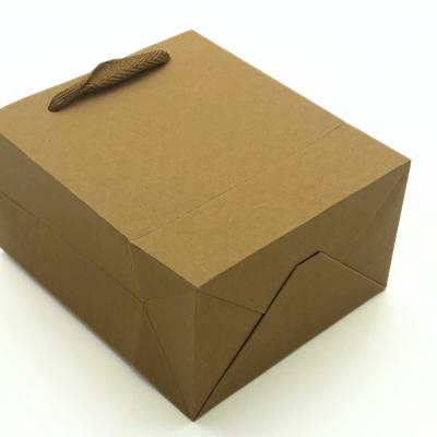 China Custom Logo Recyclable Flexographic Printed Christmas-Style Kraft Paper Gift Bags With Rope Handle for sale