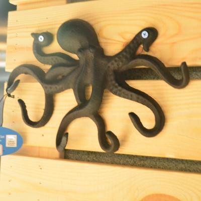 Cina Ganci creativi fissati al muro del cappello del ghisa del polipo in vendita