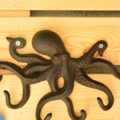 Cina Ganci creativi fissati al muro del cappello del ghisa del polipo in vendita