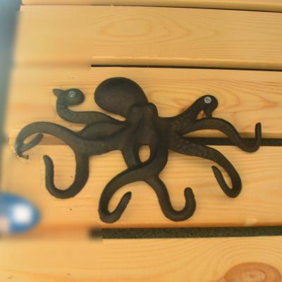 Cina Ganci creativi fissati al muro del cappello del ghisa del polipo in vendita
