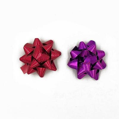 Cina l'arco di plastica olografico del nastro della stella 3inch ha personalizzato l'OEM di colore in vendita