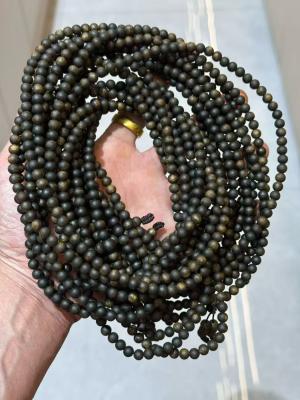 China Dark Brown With Natural Wood Grain Natural Agarwood Rosary Durable Resistant To Wear Ideal For Meditation Prayer And Spiritual for sale