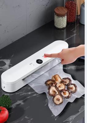 China Multifunctional Small Household Appliances Food Storage Vacuum Sealer Machine for sale